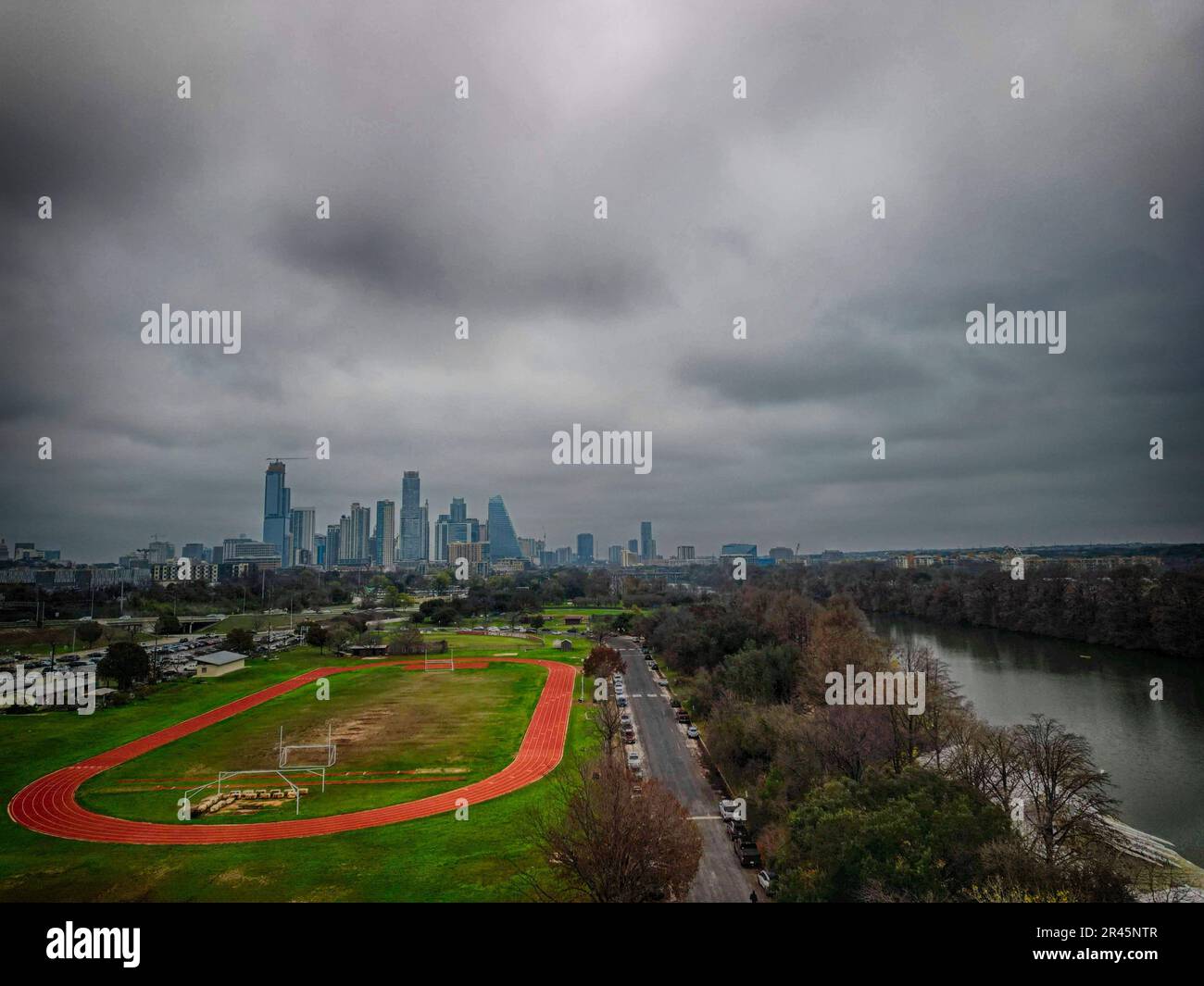 Aerial view of a vibrant city skyline at sunset, featuring an array of ...