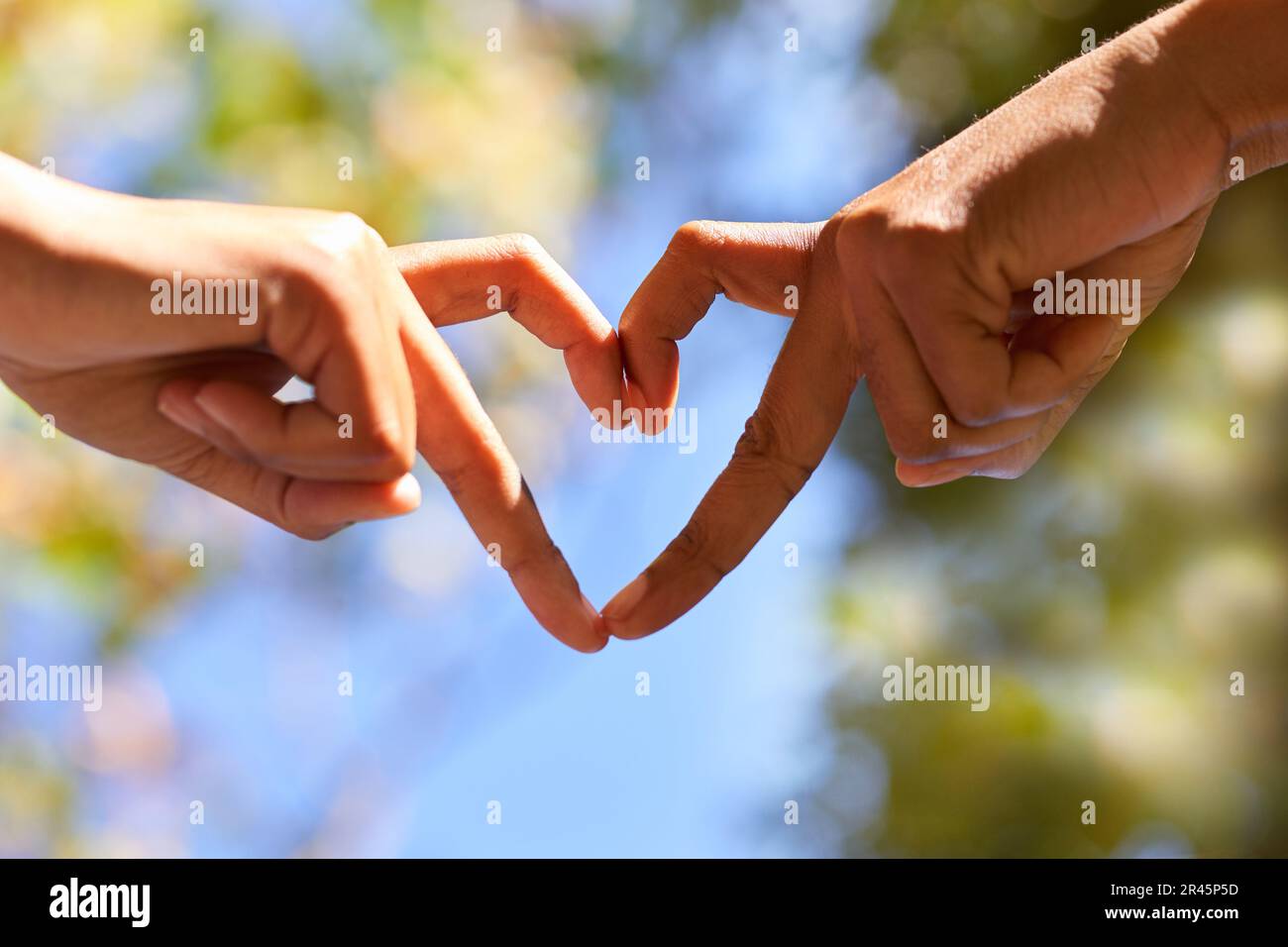Two women make heart shape with their hands, fingers - Earth Day, love ...