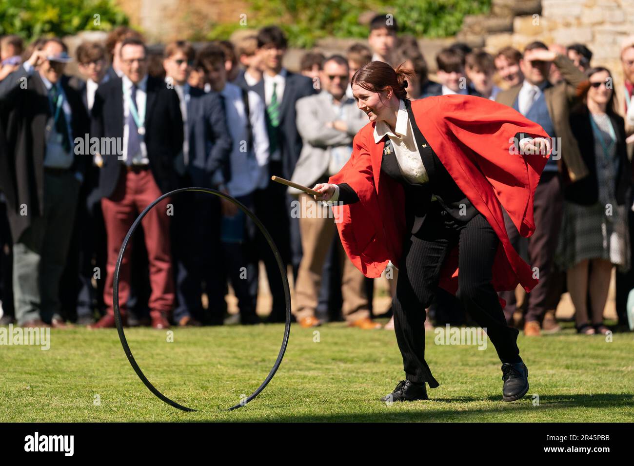 Pupils take part in the annual King's Ely Hoop Trundle on the east lawn ...