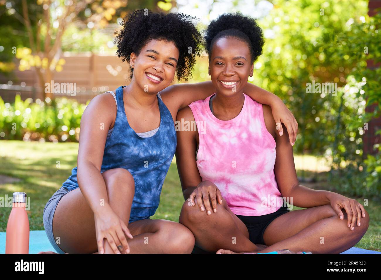 Two beautiful Black women hug after exercise in the park, summer ...