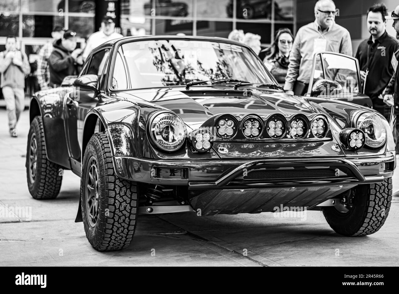 A grayscale shot of a vintage Baja Porsche classic car parked in a Sema ...