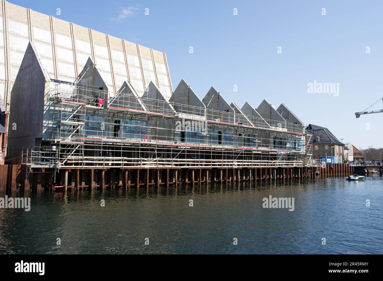 Terraced houses under construction on a quay in Copenhagen in denmark ...