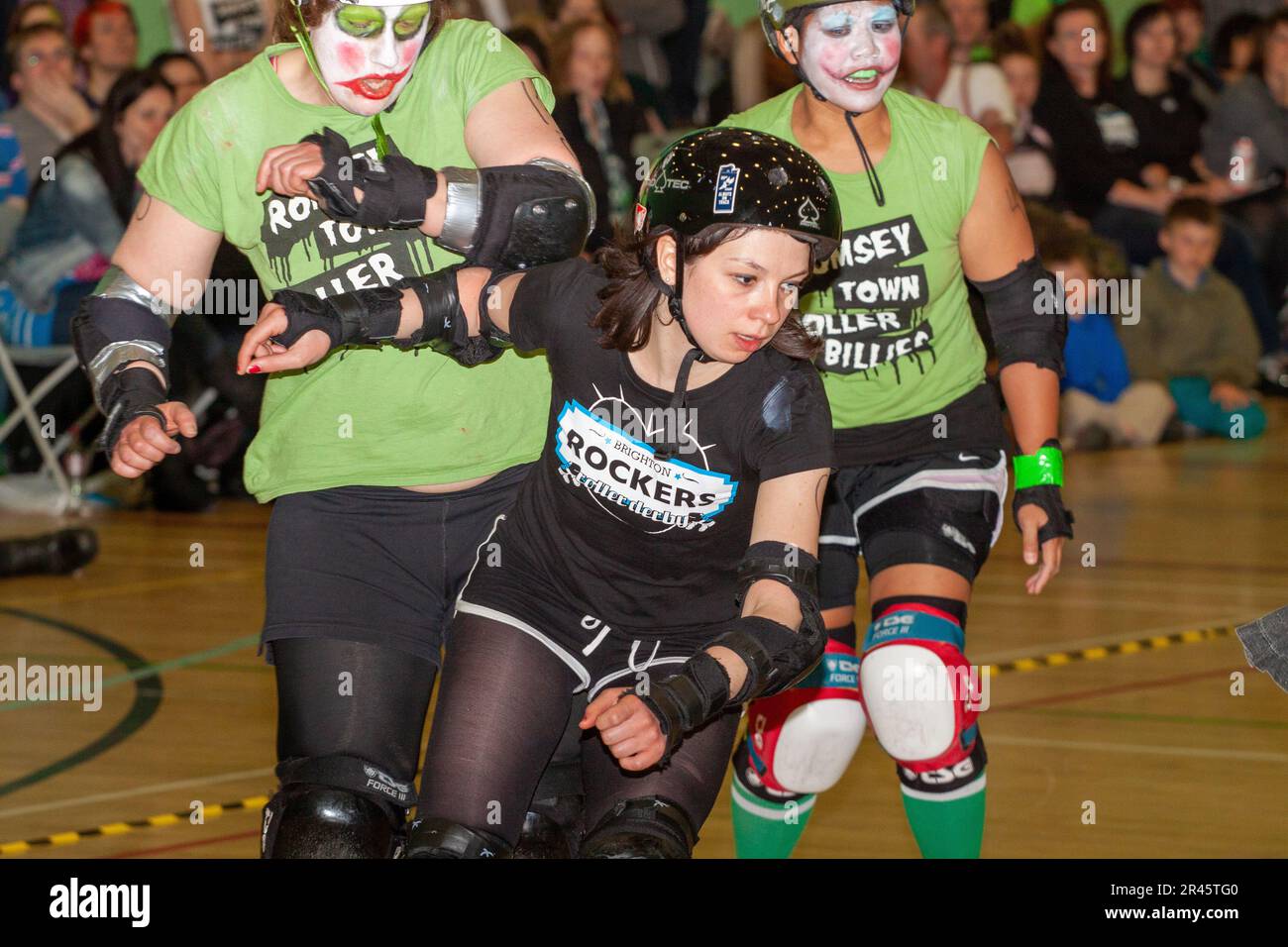 Blockers from both teams engaging in a roller derby bout at the Kelsey ...