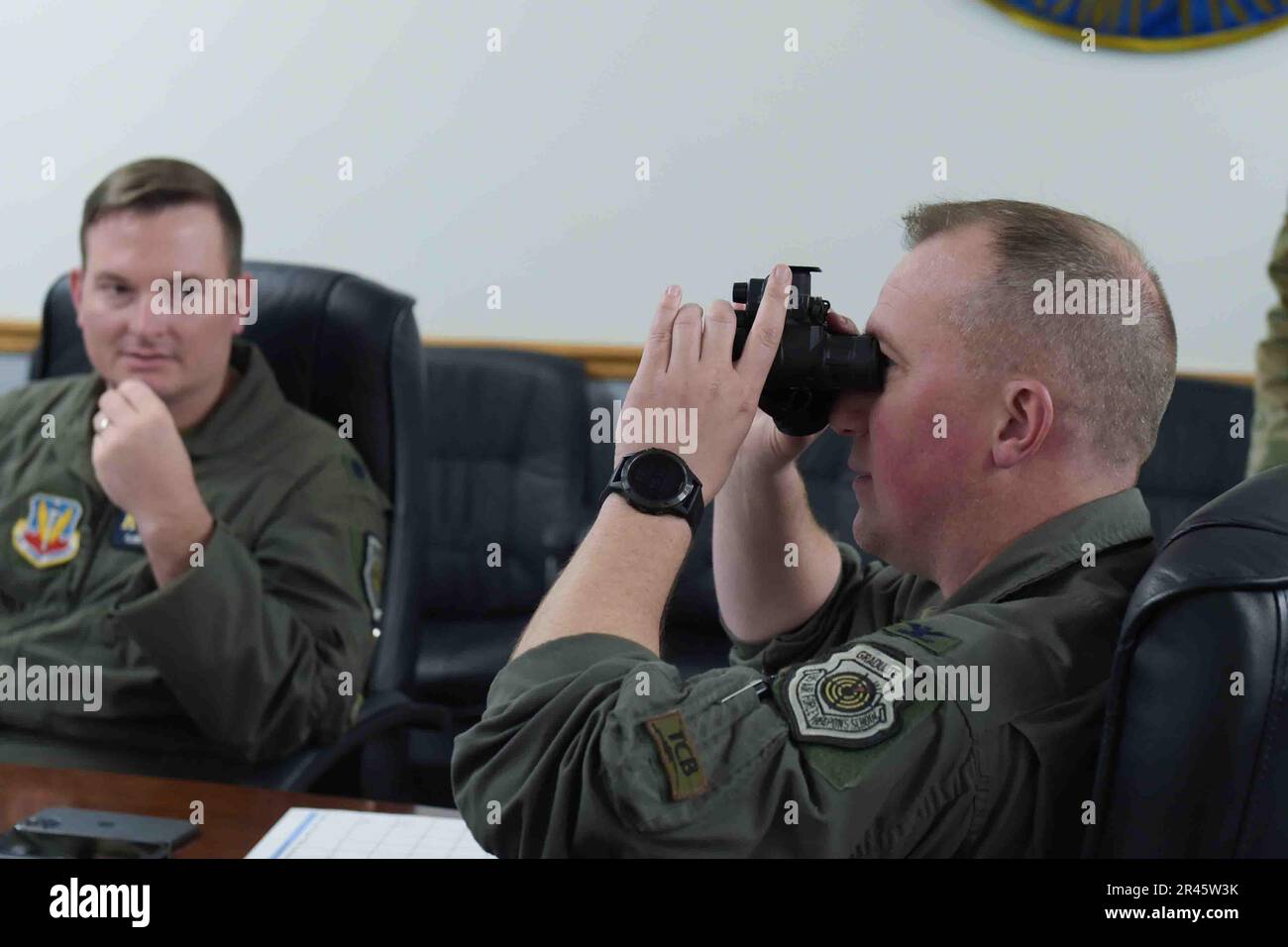 U.S. Air Force Col. Ryan Hayde, 23rd Wing vice commander, looks through ...