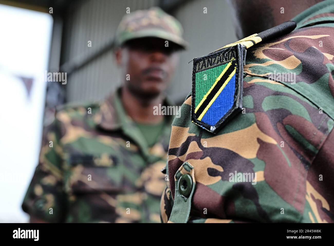 Service members from Tanzania talk after the closing ceremony of ...