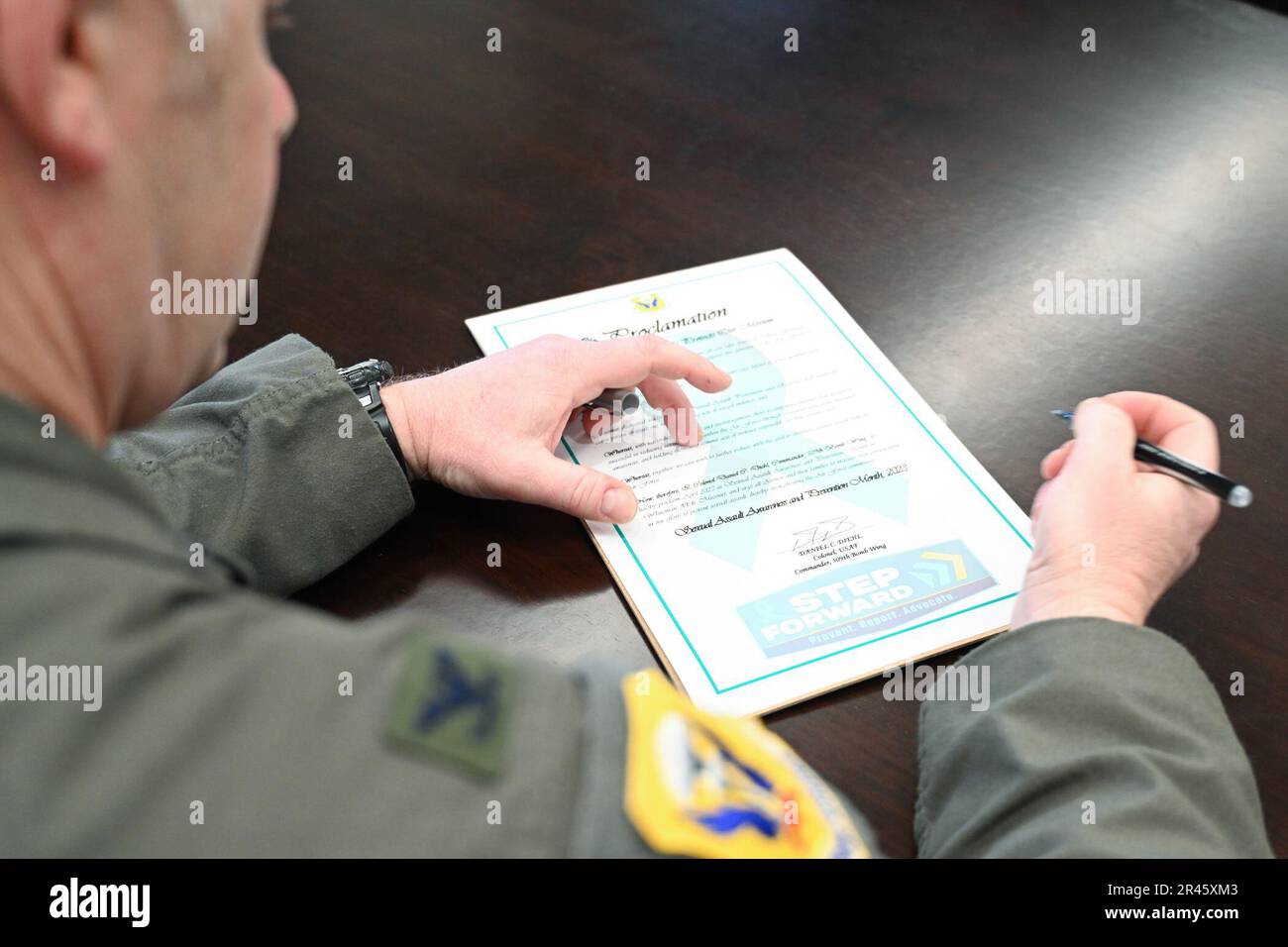 U.S. Air Force Col. Daniel Diehl, 509th Bomb Wing commander signs a ...