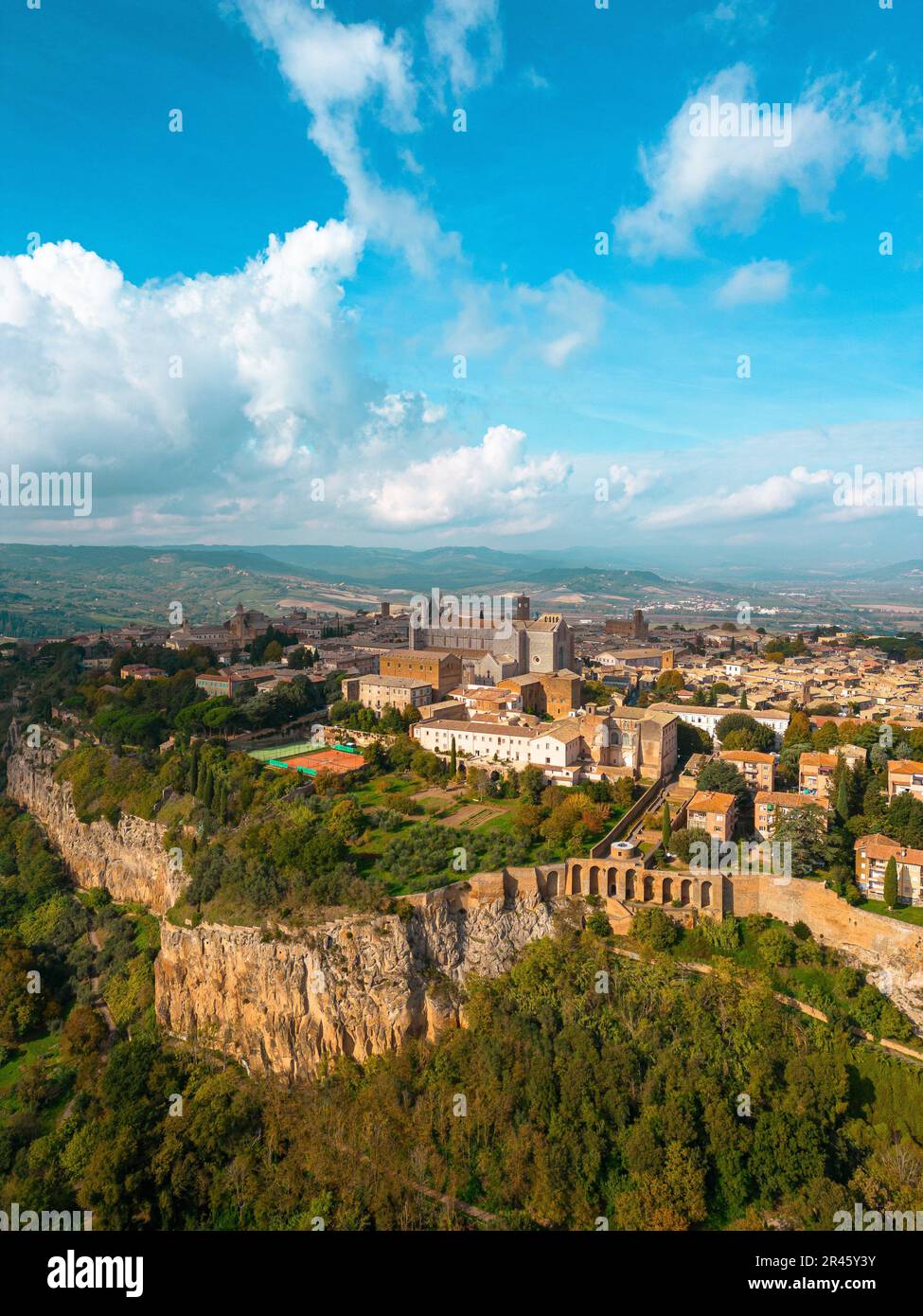 An aerial view of the Italian city of Orvieto, located on a lush green ...