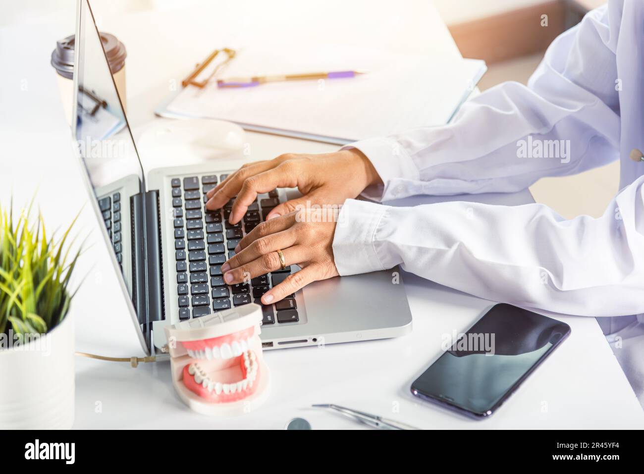 Dentist doctor or nurse in uniform use oral software teeth Xray and ...