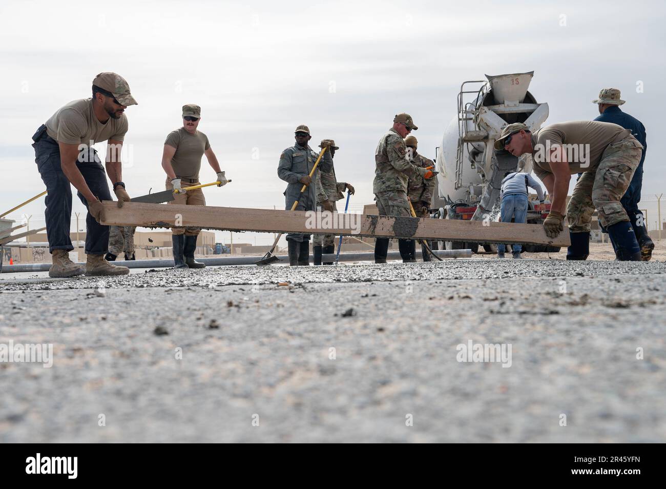 379th Expeditionary Civil Engineer Squadron Airmen lay concrete at the ...