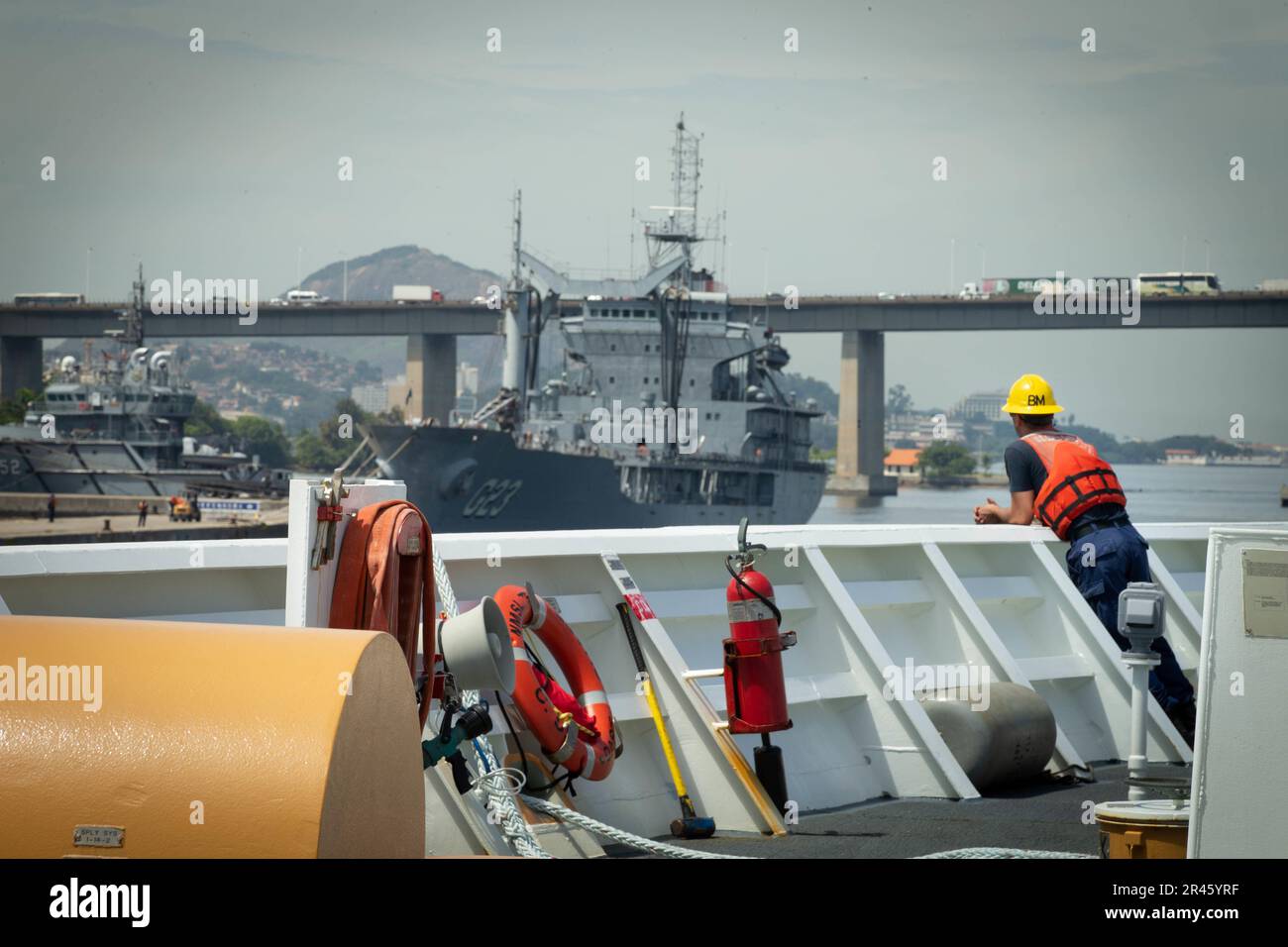 A USCGC Stone (WMSL 758) crew member observes Brazil Navy ships ...