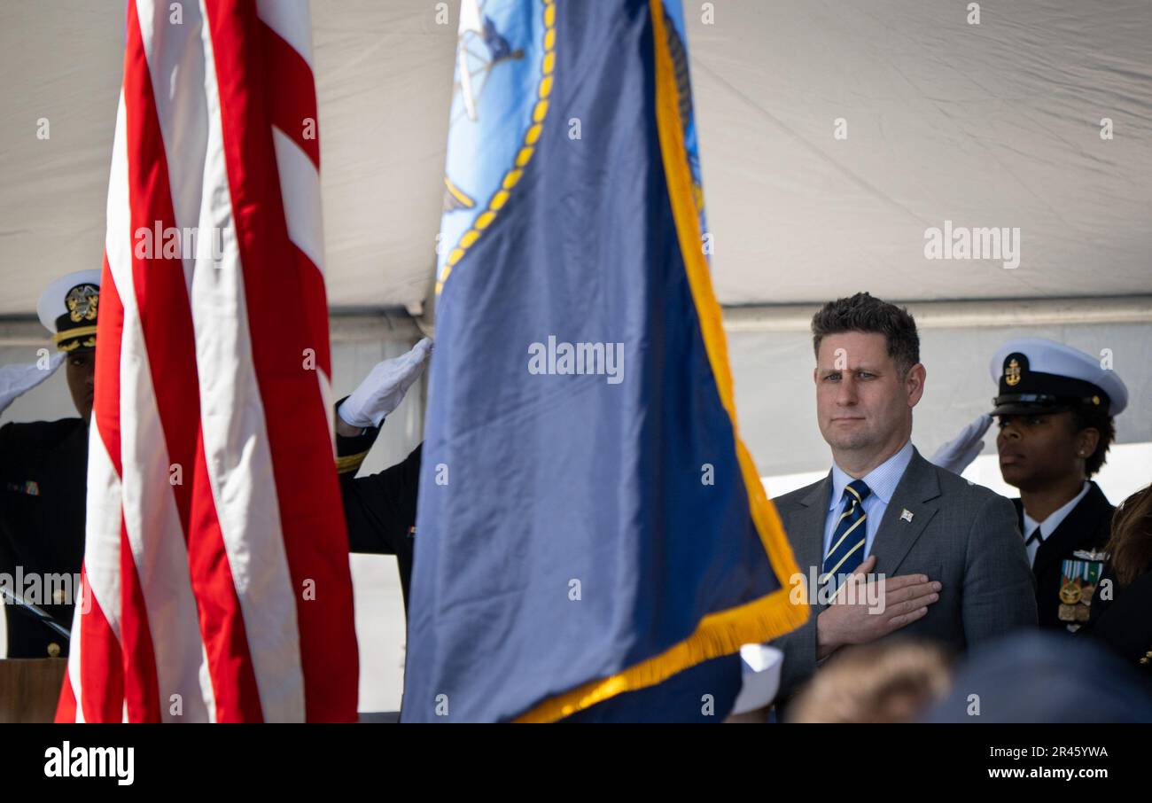 Russell Rumbaugh, wearing a grey suit, was one of several distinguised ...