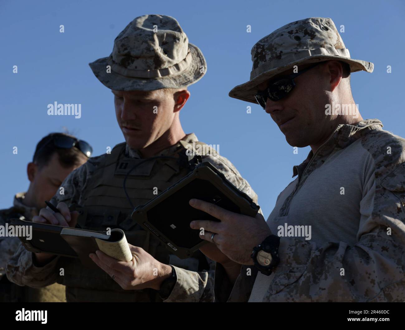U.S. Marine Corps Capt. David Kramer, left, and Capt. Reginald Walker ...