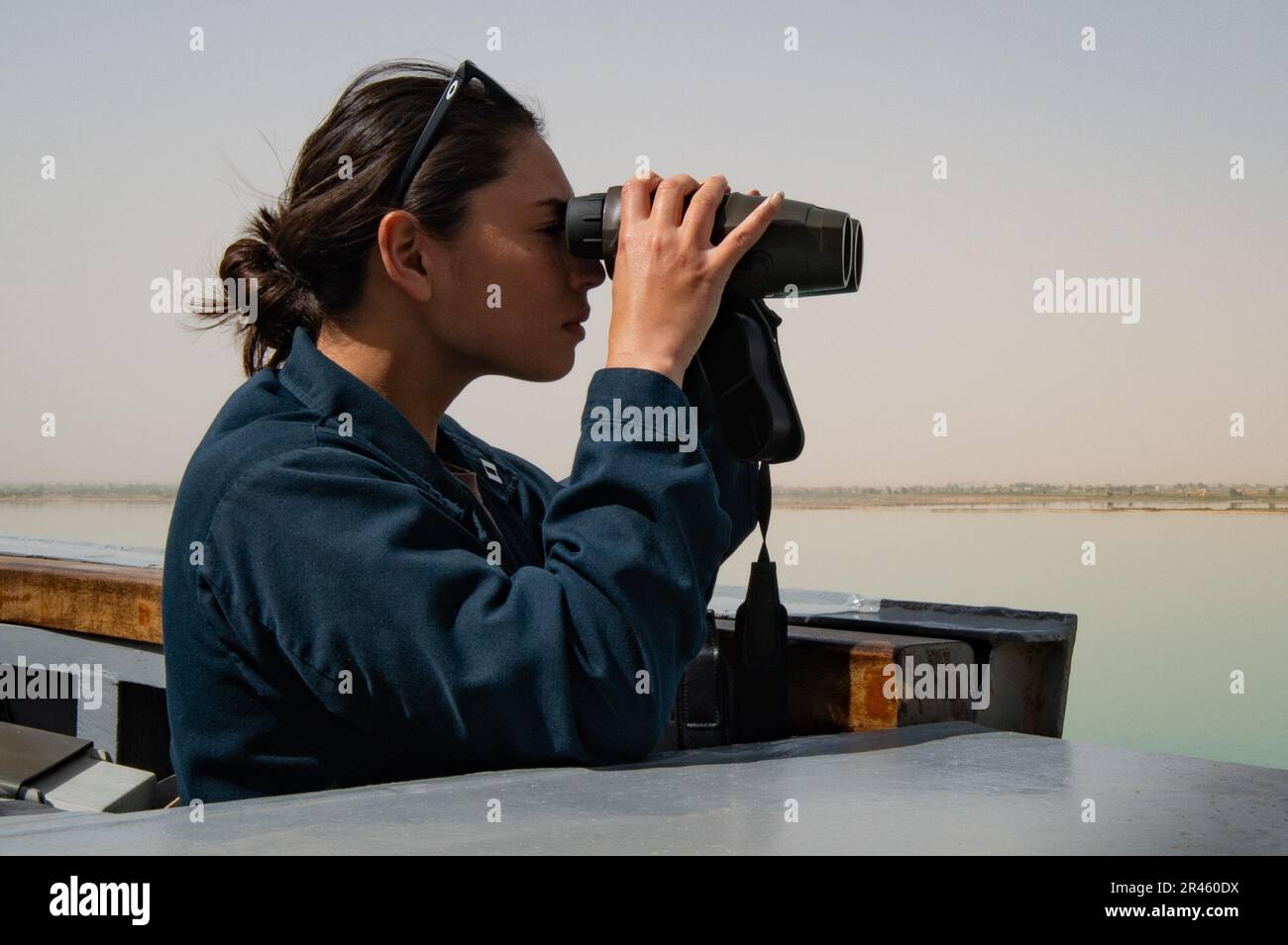 230405-N-NH267-1058 SUEZ CANAL (April 5, 2023) Lt. Haley Unger scans a laser rangefinder on a ...