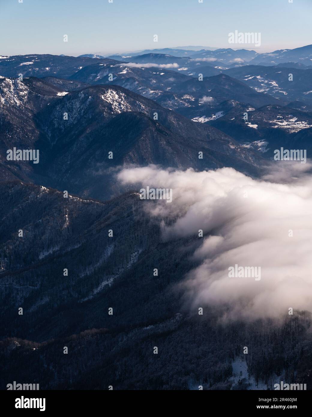A scenic mountain landscape with snow-covered slopes Stock Photo - Alamy