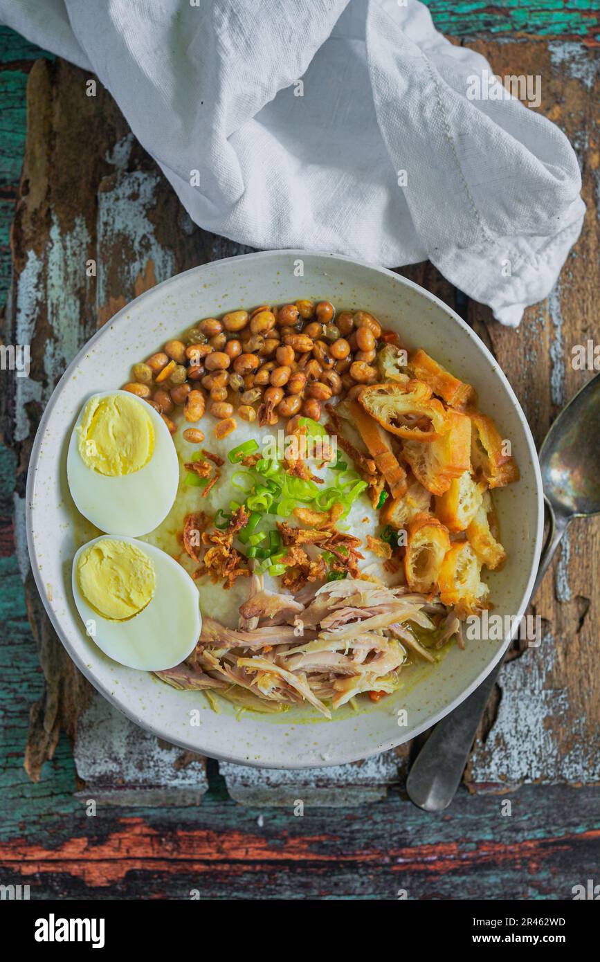 Bubur ayam, Indonesian rice porridge with shredded chicken and served ...