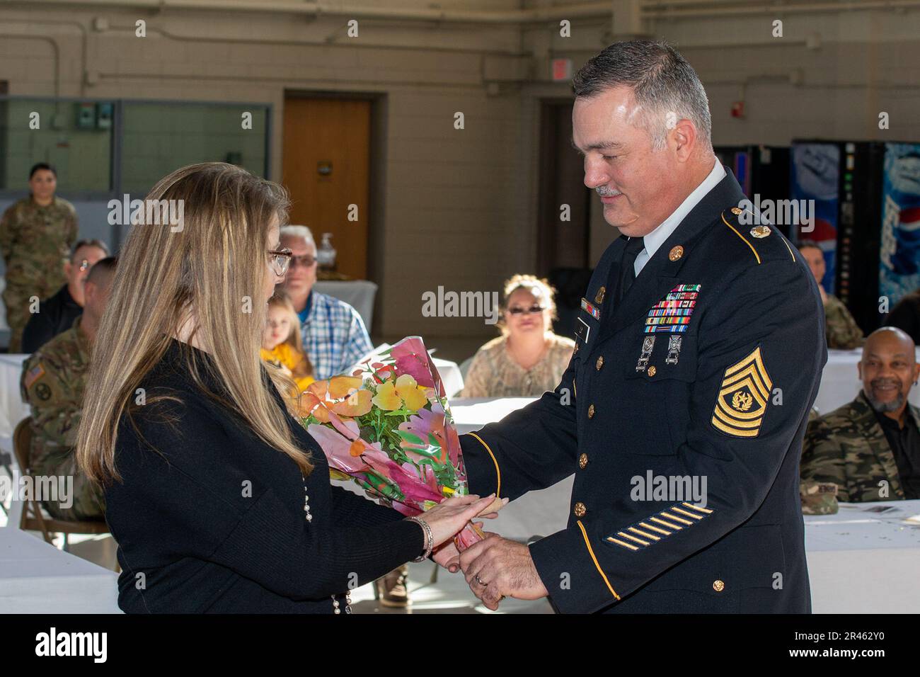 Command Sgt. Maj. Randy Ly, right, completes his last official duty for ...