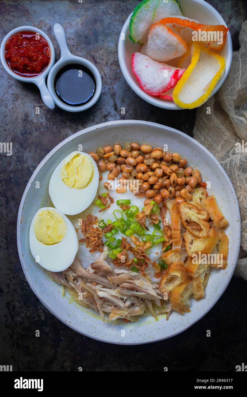 Bubur ayam, Indonesian rice porridge with shredded chicken and served ...