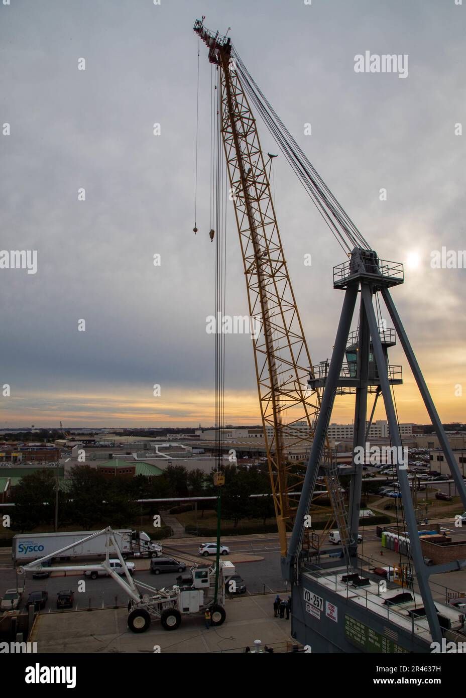 A crane prepares to lift the first-in-class aircraft carrier USS Gerald ...
