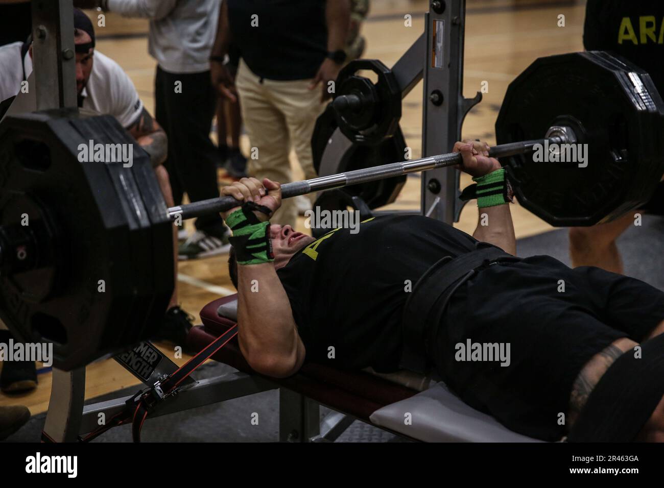 U.S. Army Sgt. Shawn Lee, bench pressing over 300 lbs. during the U.S ...