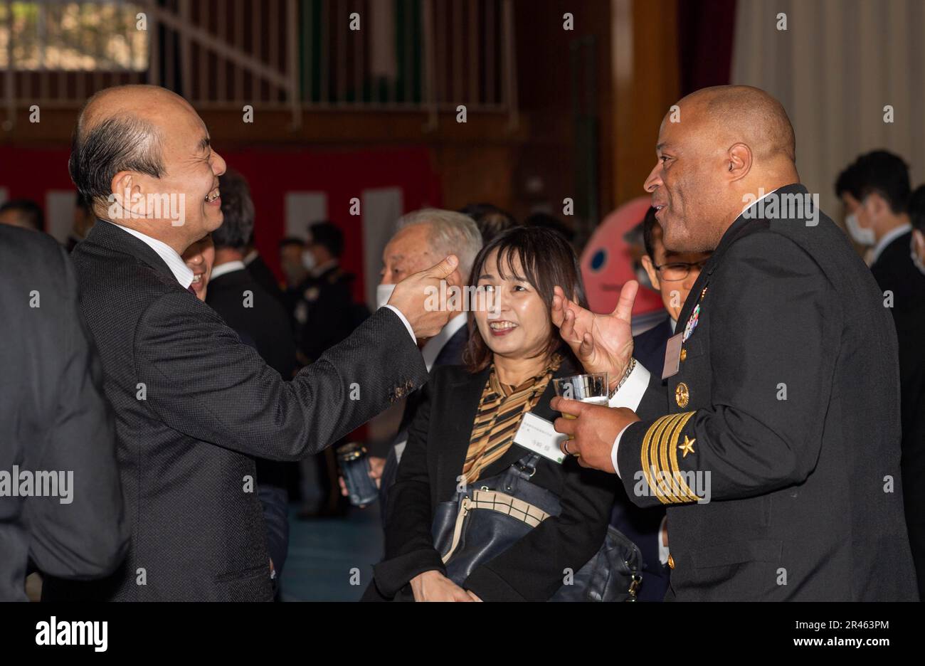 Capt. David Adams, Commander, Fleet Activities Sasebo (CFAS), speaks to retired Vice Adm ...