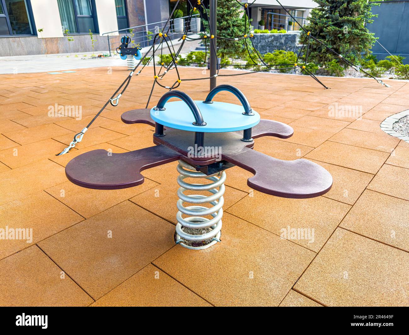 Children's rocking chair on the playground Stock Photo - Alamy