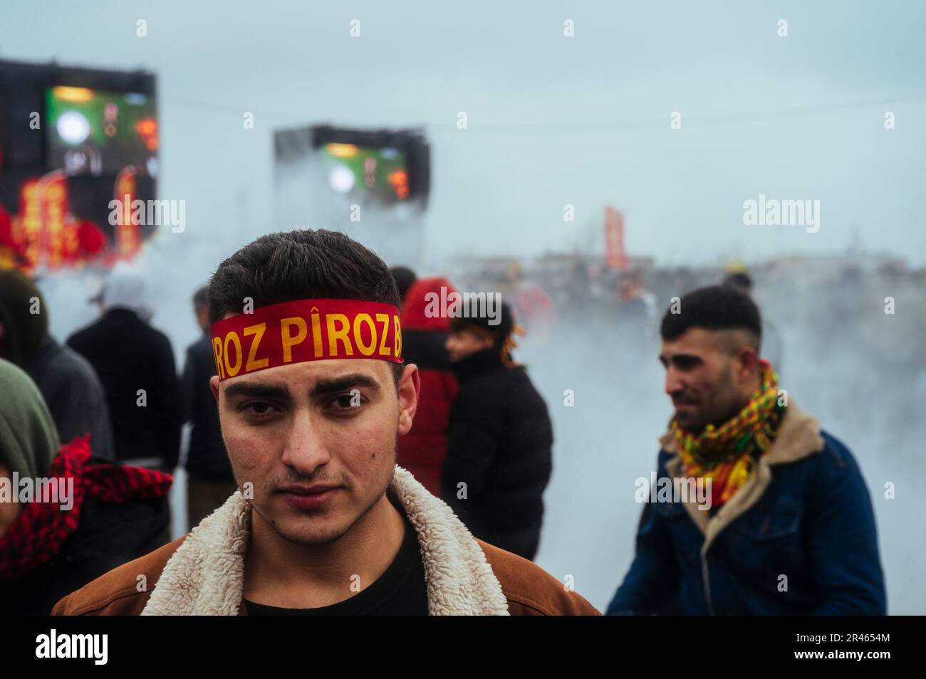 A youth seen wearing a headscarf that says “happy Newroz” during the ...