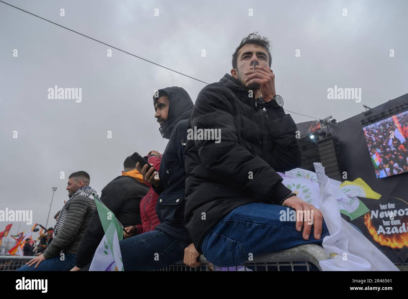 A youth seen smoking a cigarette during the celebration. The ...