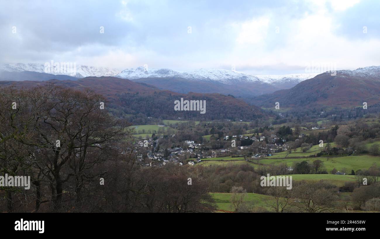A green landscape with buildings near mountain in Windermere Stock ...