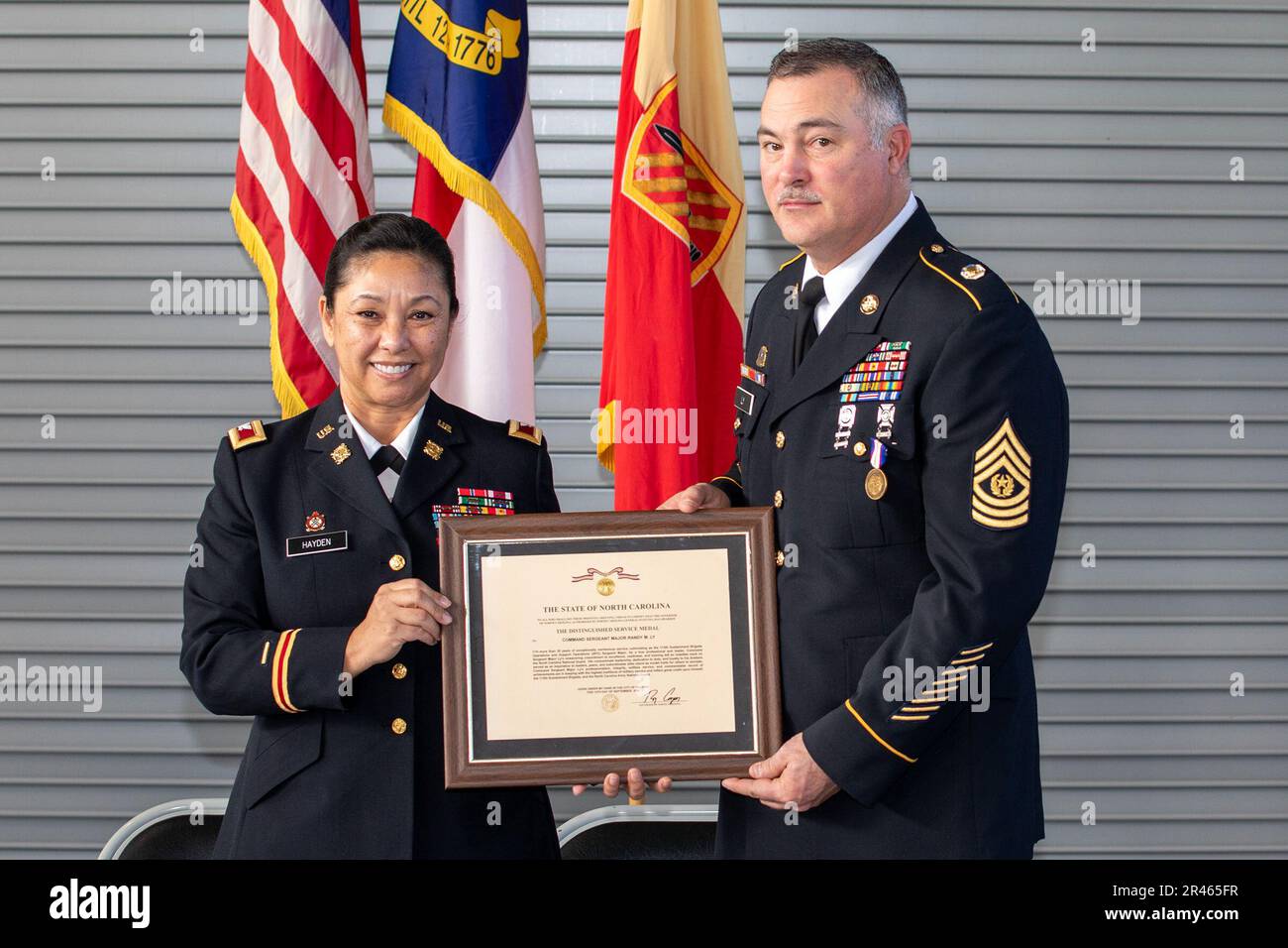Command Sgt. Maj. Randy Ly, right, completes his last official duty for ...