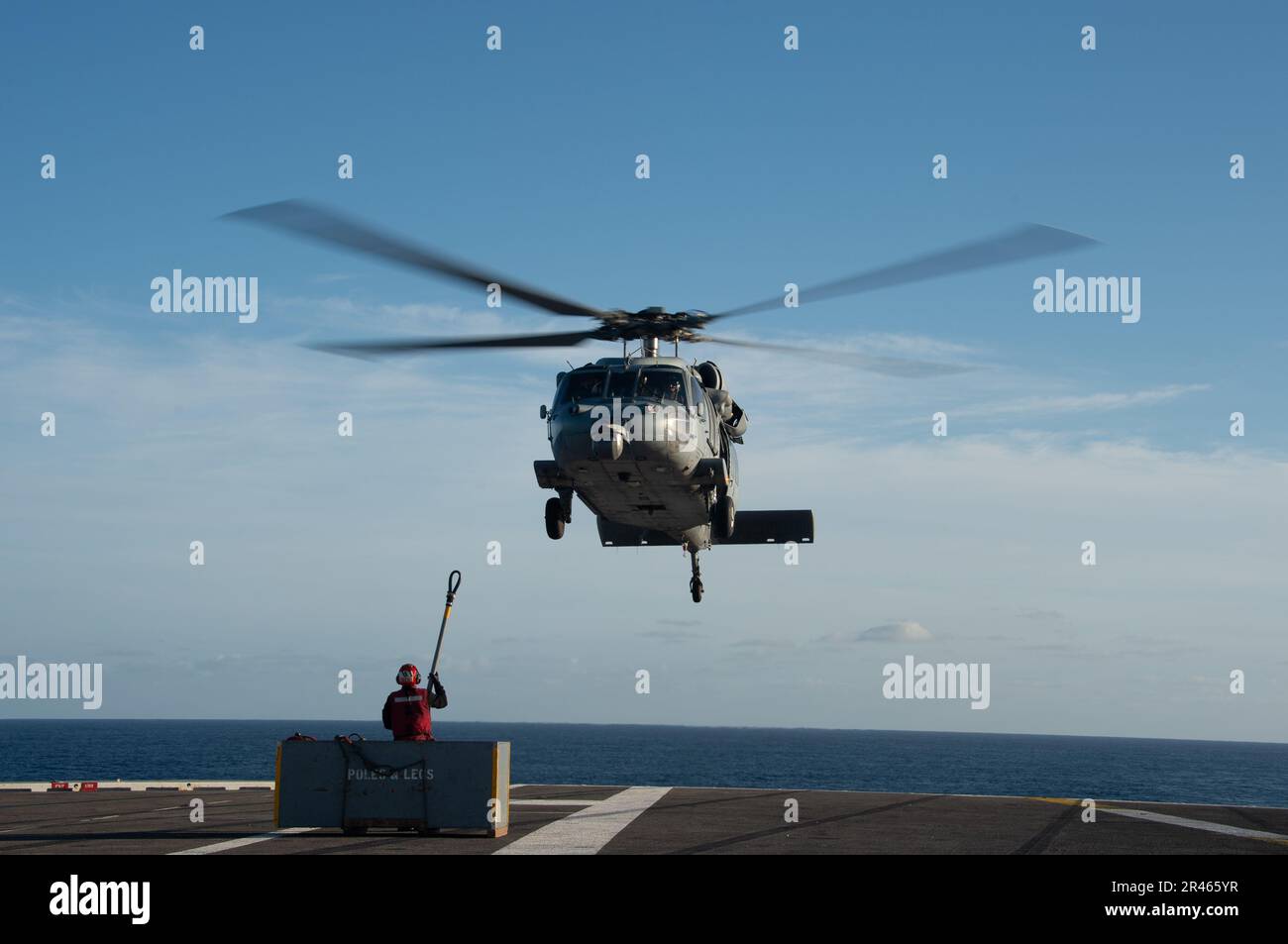 230118-N-MD461-1356 PACIFIC OCEAN (Jan. 18, 2022) A Sailor prepares to ...