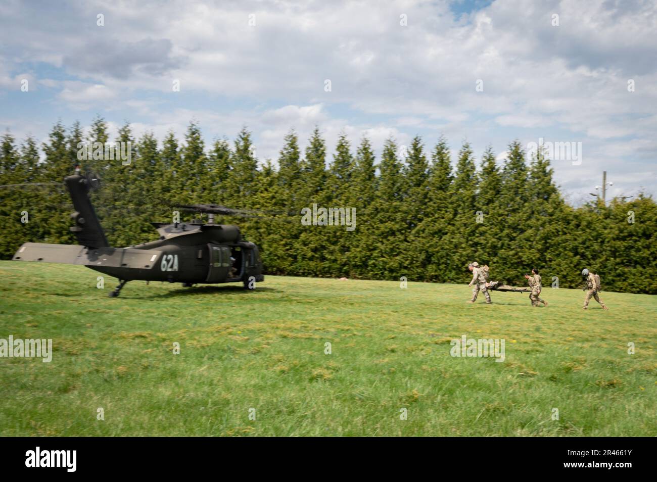 U.S. Army role players carry a notional casualty to a waiting UH-60M ...