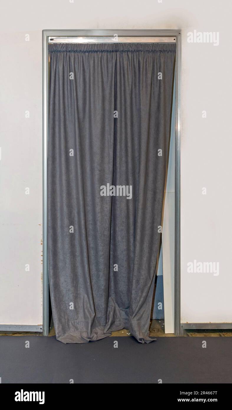 Booth entrance door closed with textile curtain Stock Photo - Alamy