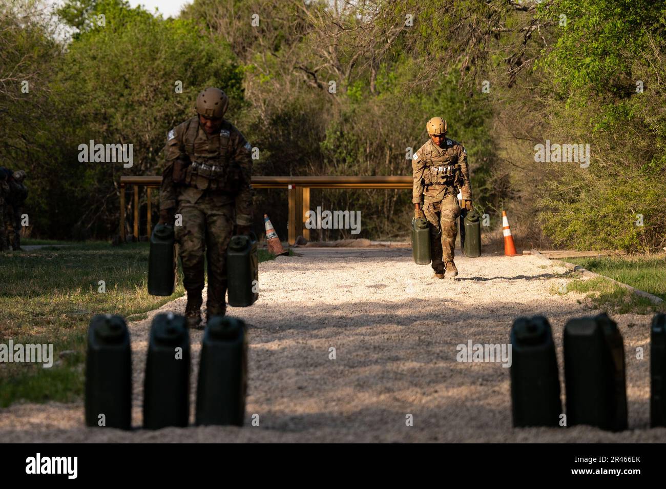As teams, candidates maneuver an obstacle course during the Special ...