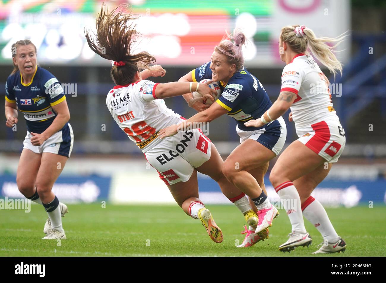 Leeds Rhinos' Amy Hardcastle (centre) is tackled by St Helens' Darcy ...