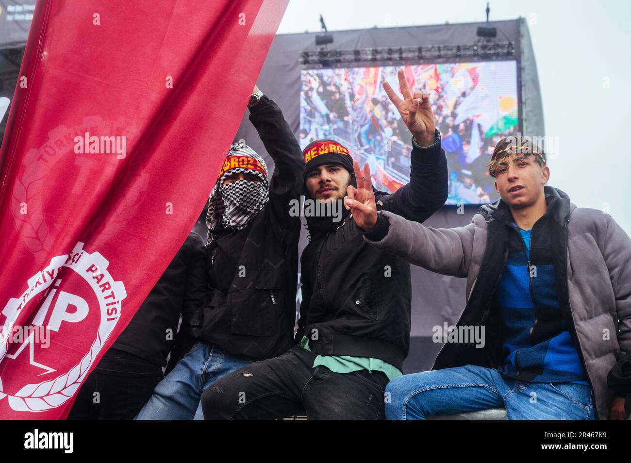 Istanbul, Turkey. 19th Mar, 2023. Youths make gestures near the flag of ...