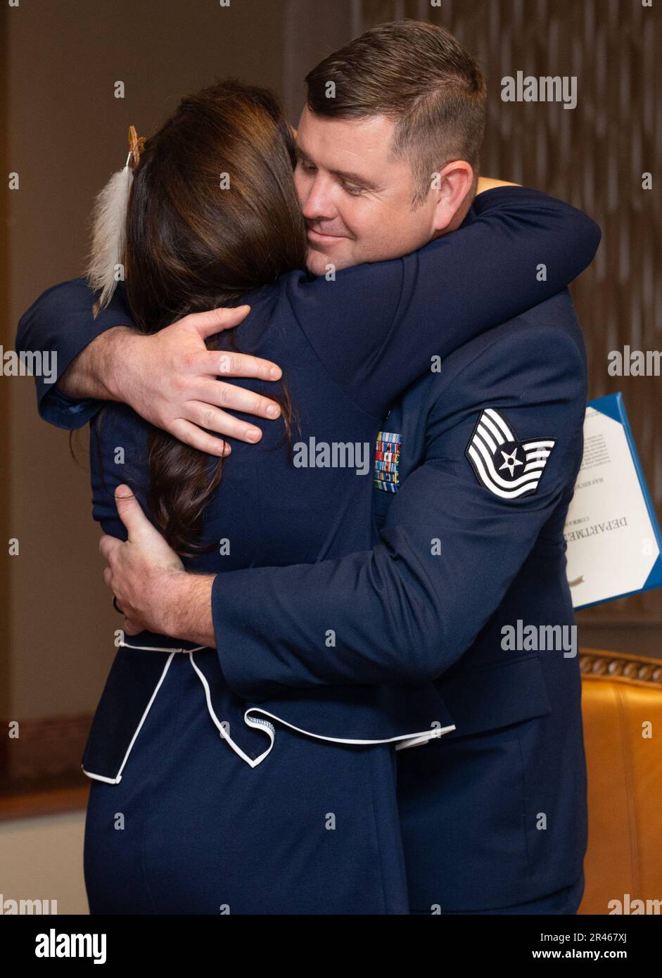 Tech. Sgt. Robert Melcher hugs his wife, Jacqueline, director of the ...