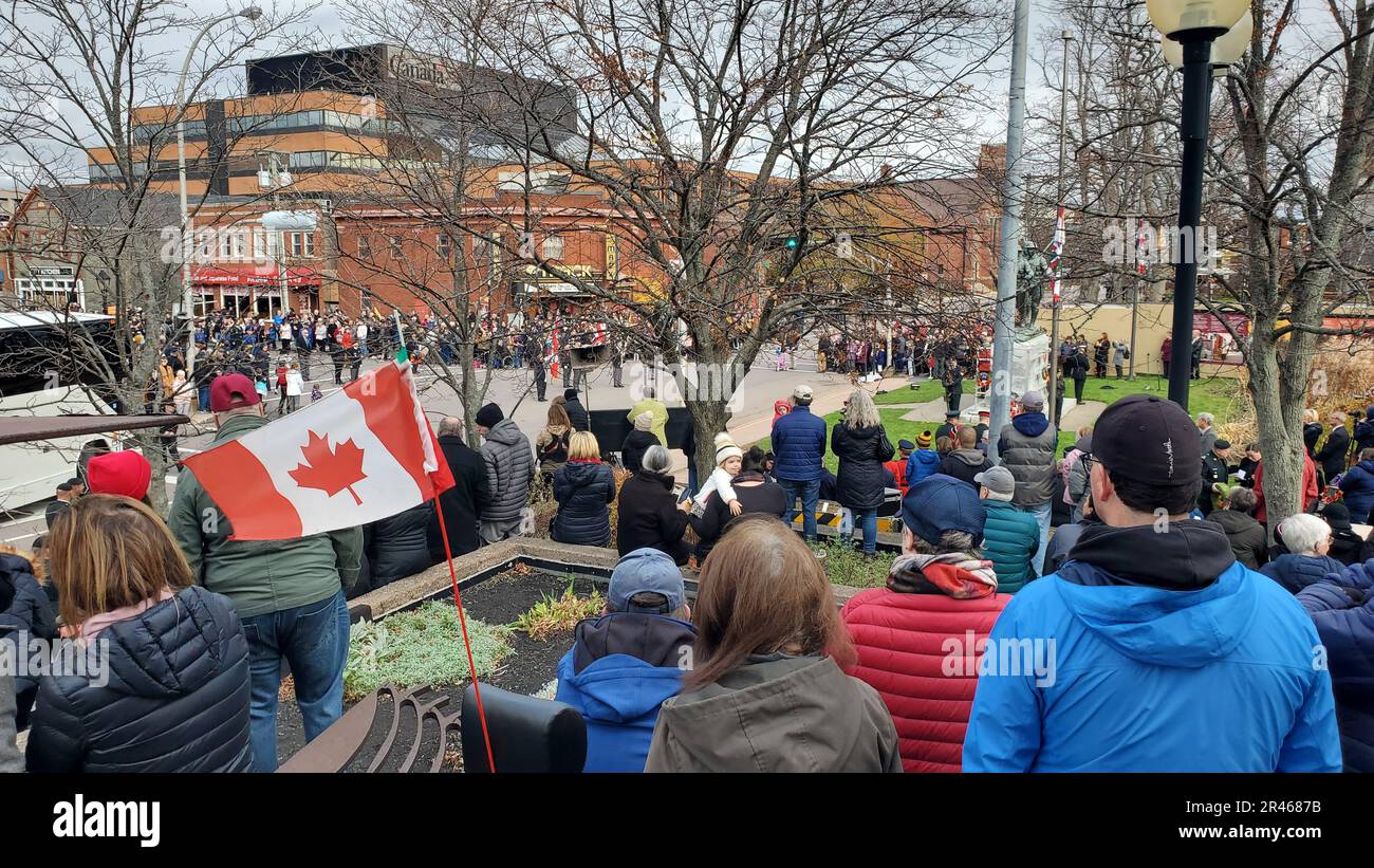 A large crowd of people are gathering together to celebrate in a street ...