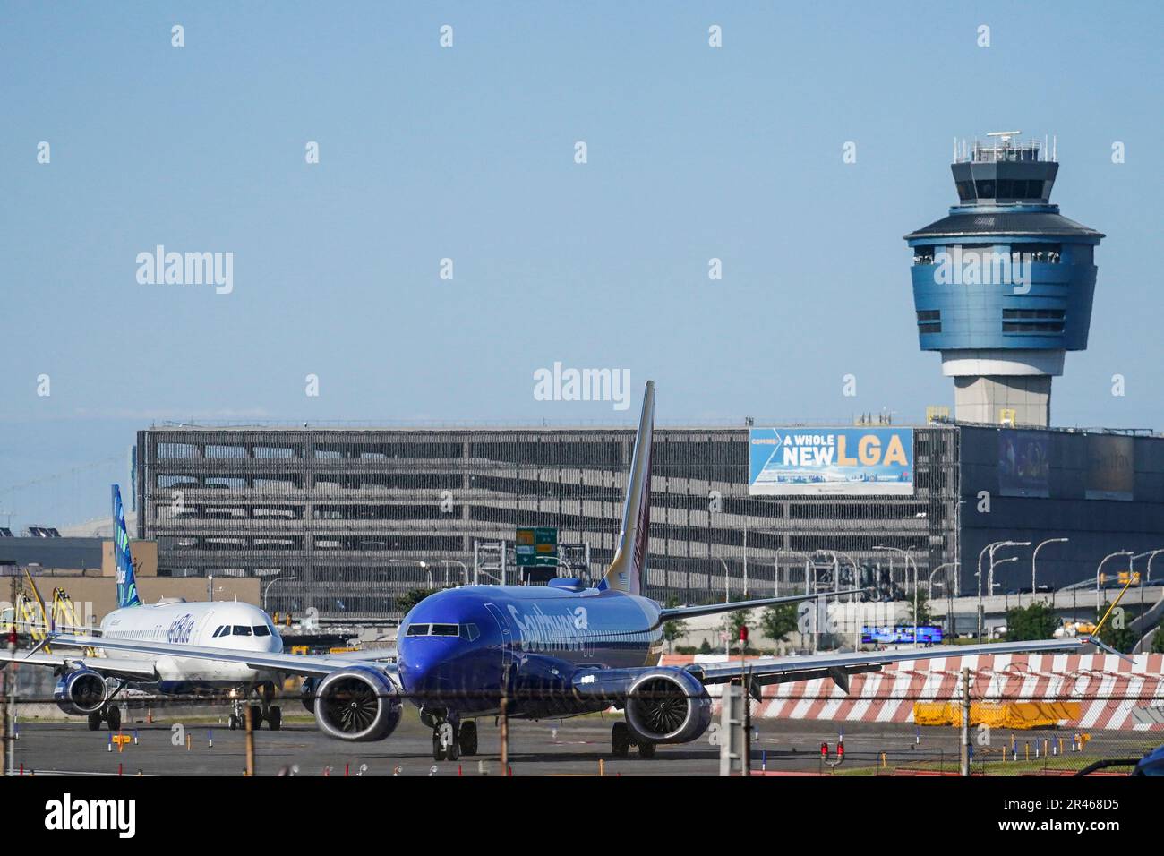 LaGuardia Airport's air traffic control tower, right, is shown as ...