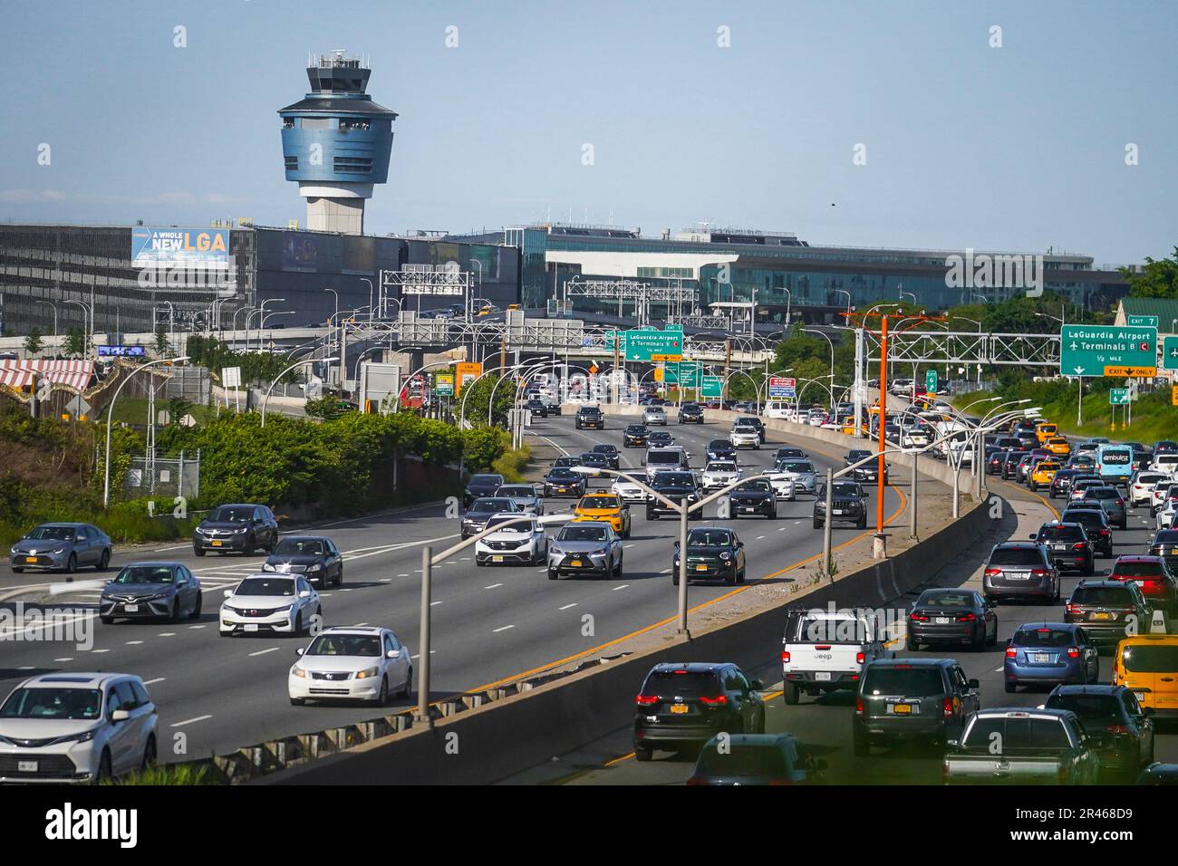 LaGuardia Airport's air traffic control tower, left, looms above ...