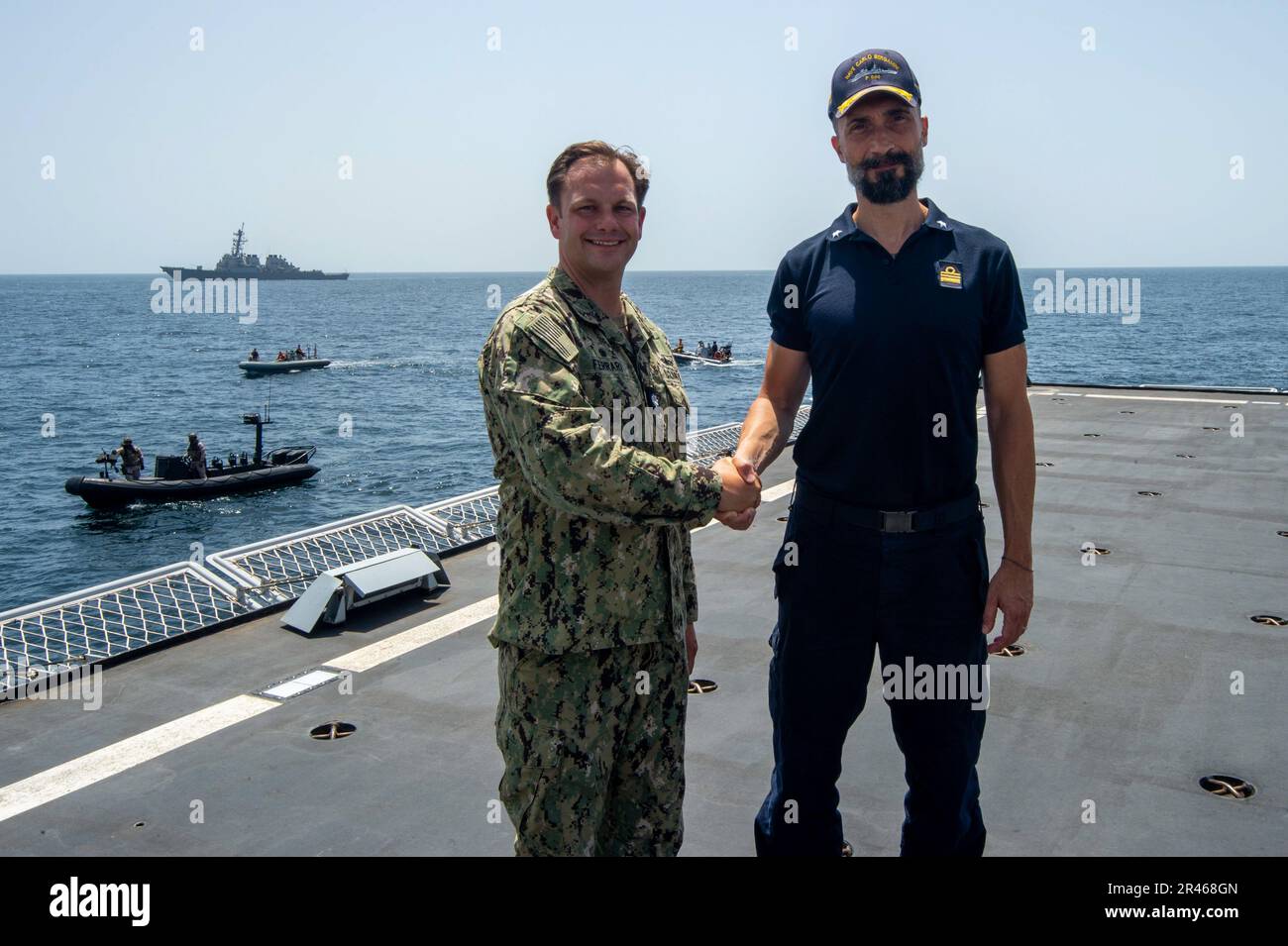 230324-N-NH267-1027 ARABIAN SEA (March 24, 2023) Cdr. Jake Ferrari left ...