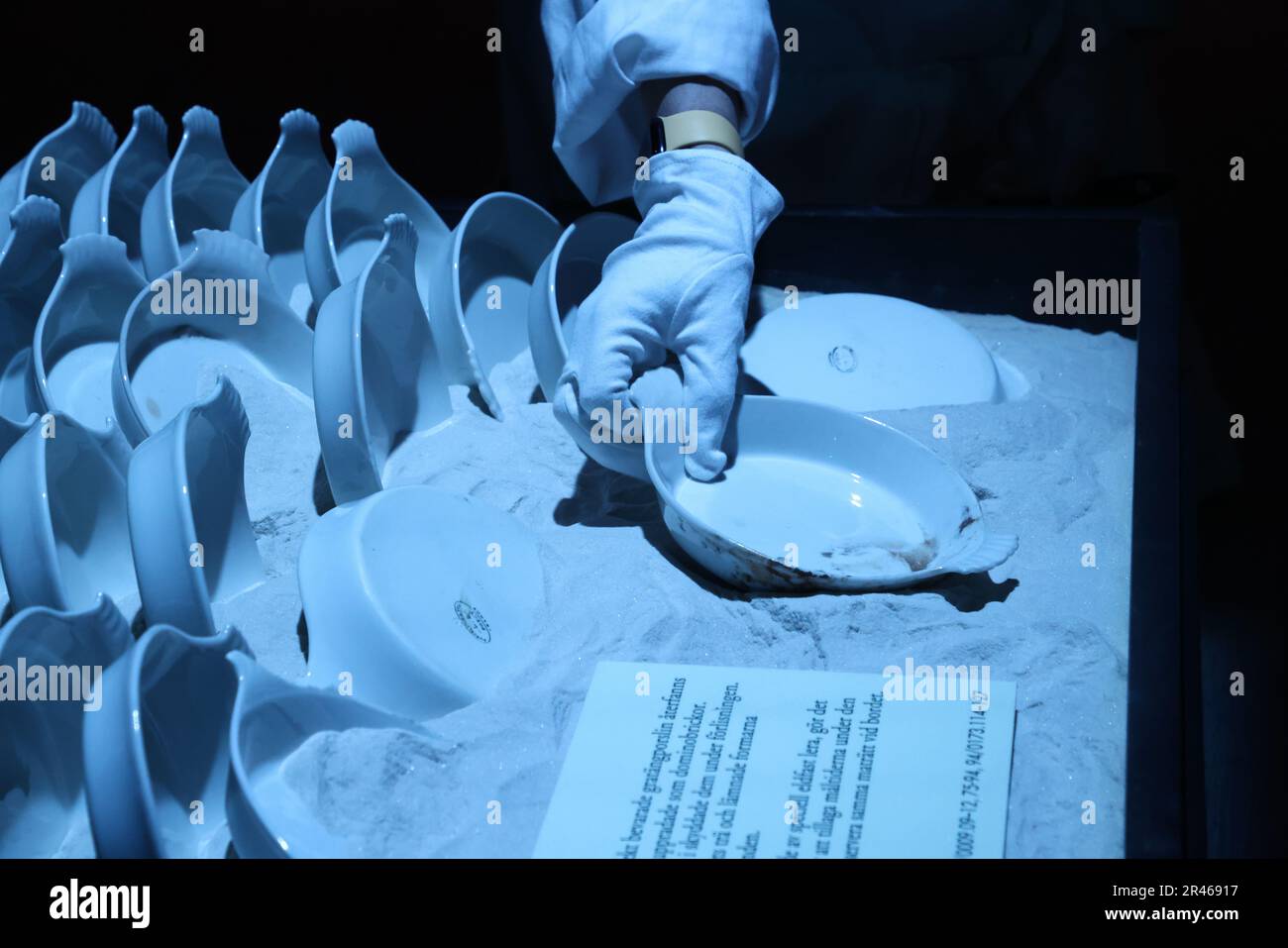 Perfectly preserved porcelain dishes found in the sand, photographed ...