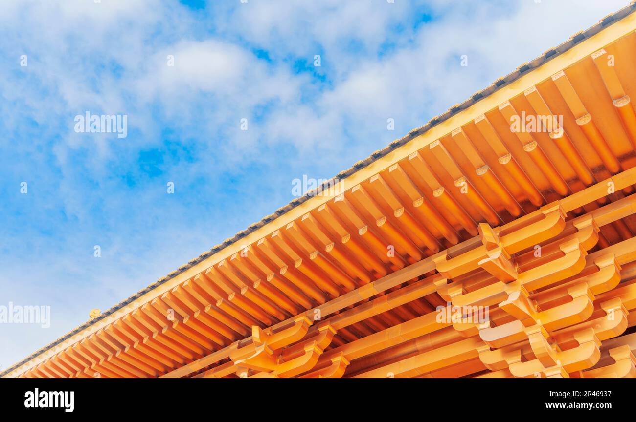 A traditional Chinese rooftop view with a stunning blue sky in the ...