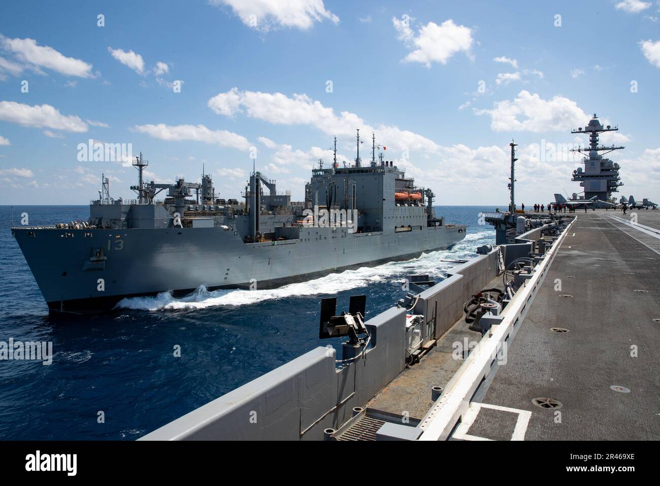 The first-in-class aircraft carrier USS Gerald R. Ford (CVN 78) pulls alongside the dry cargo ...