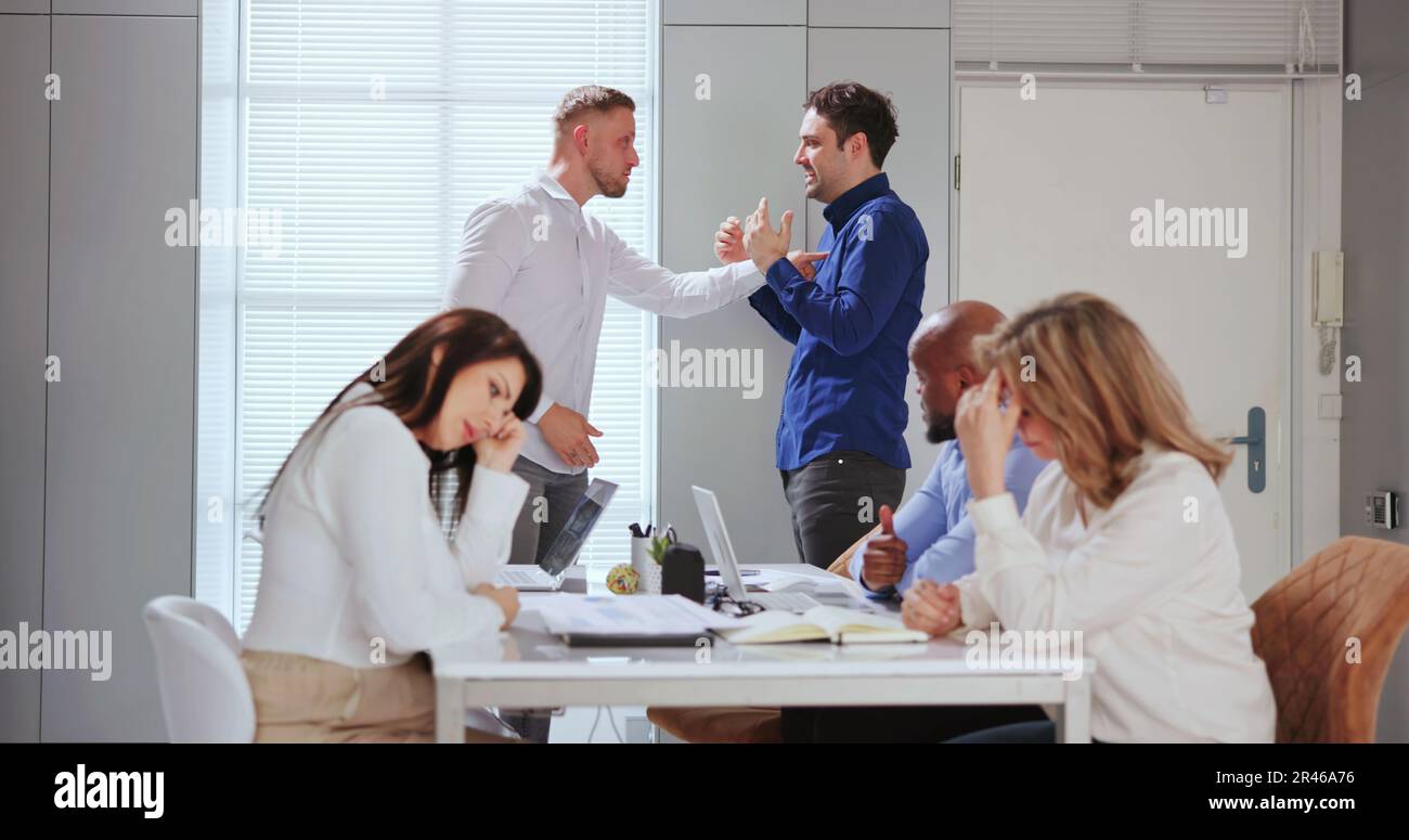 Angry Dominant Colleague Bullying Person At Workplace Stock Photo - Alamy