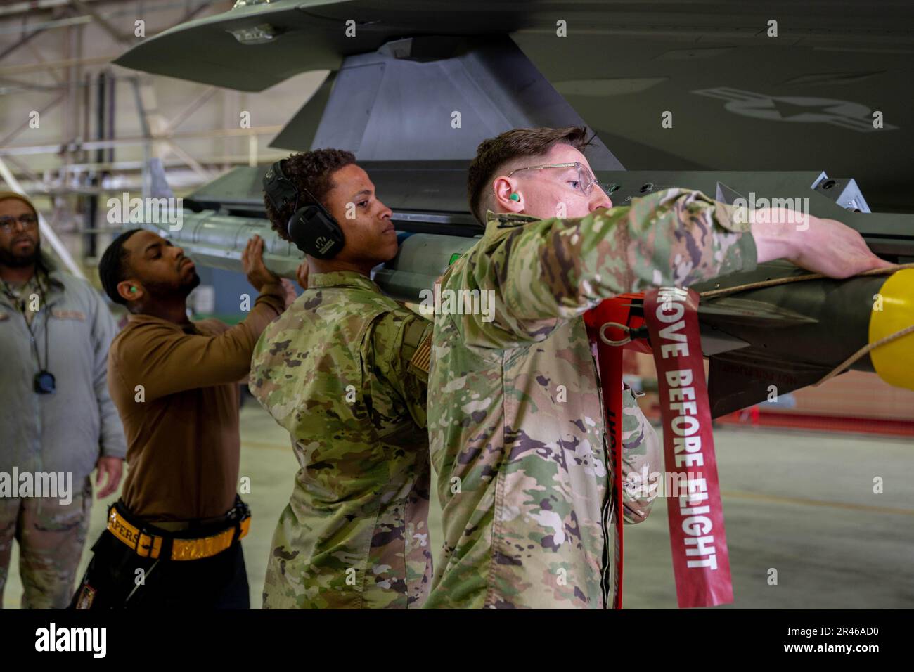 A U.S. Air Force weapons load crew assigned to the 748th Aircraft ...