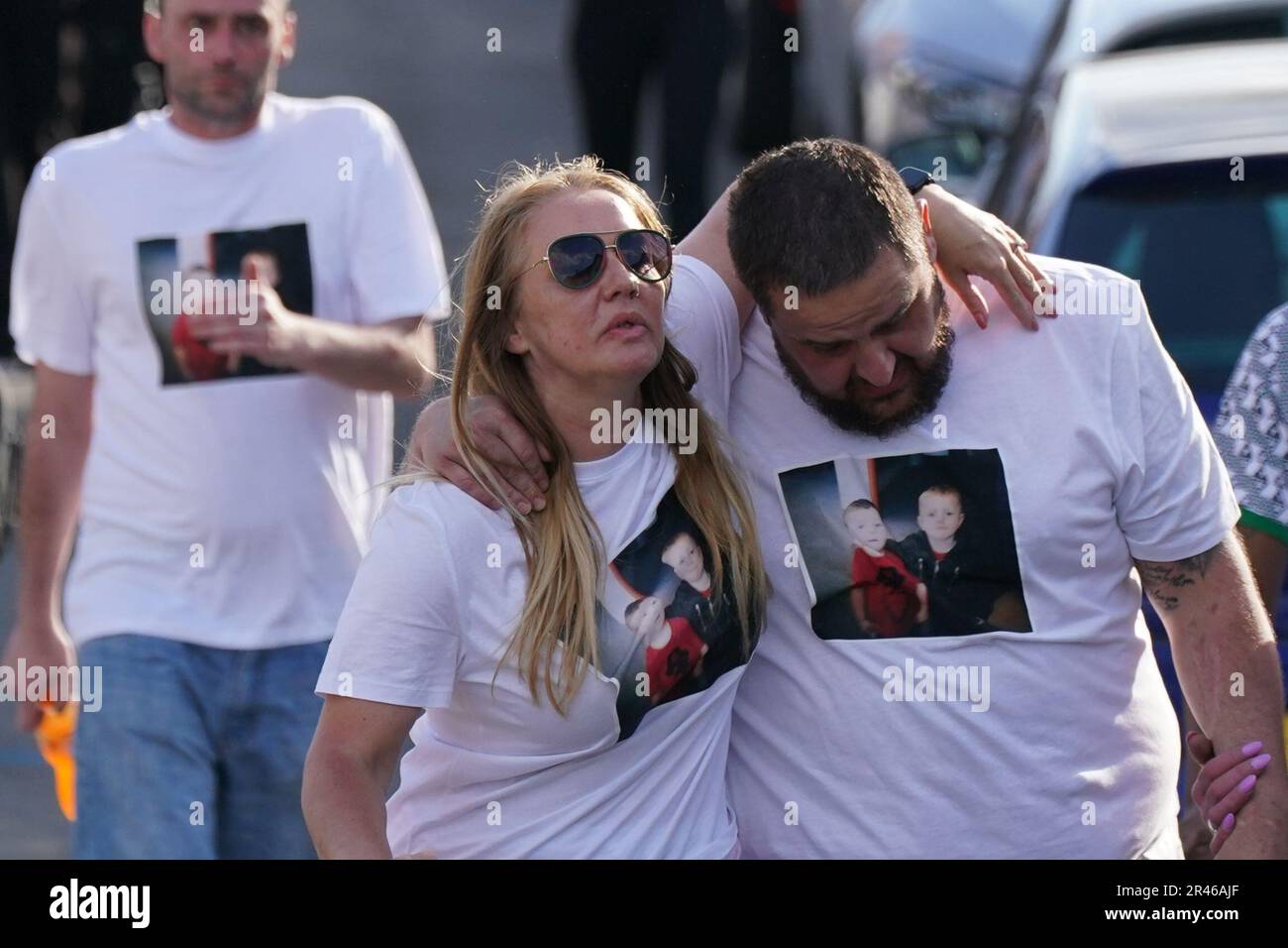 People attend a vigil for the victims of a road traffic collision on ...