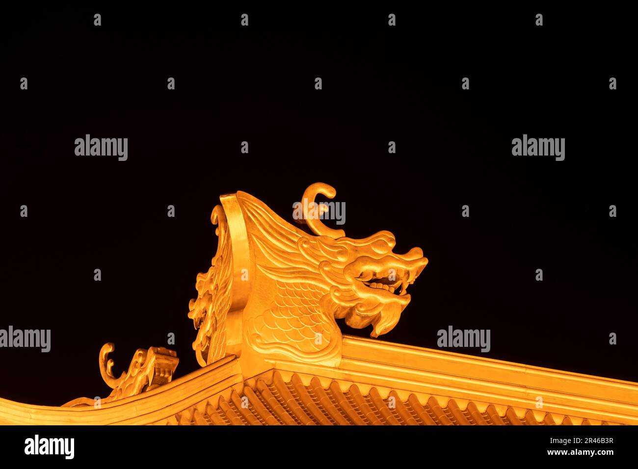 A detailed night shot of a traditional Chinese dragon head decoration ...