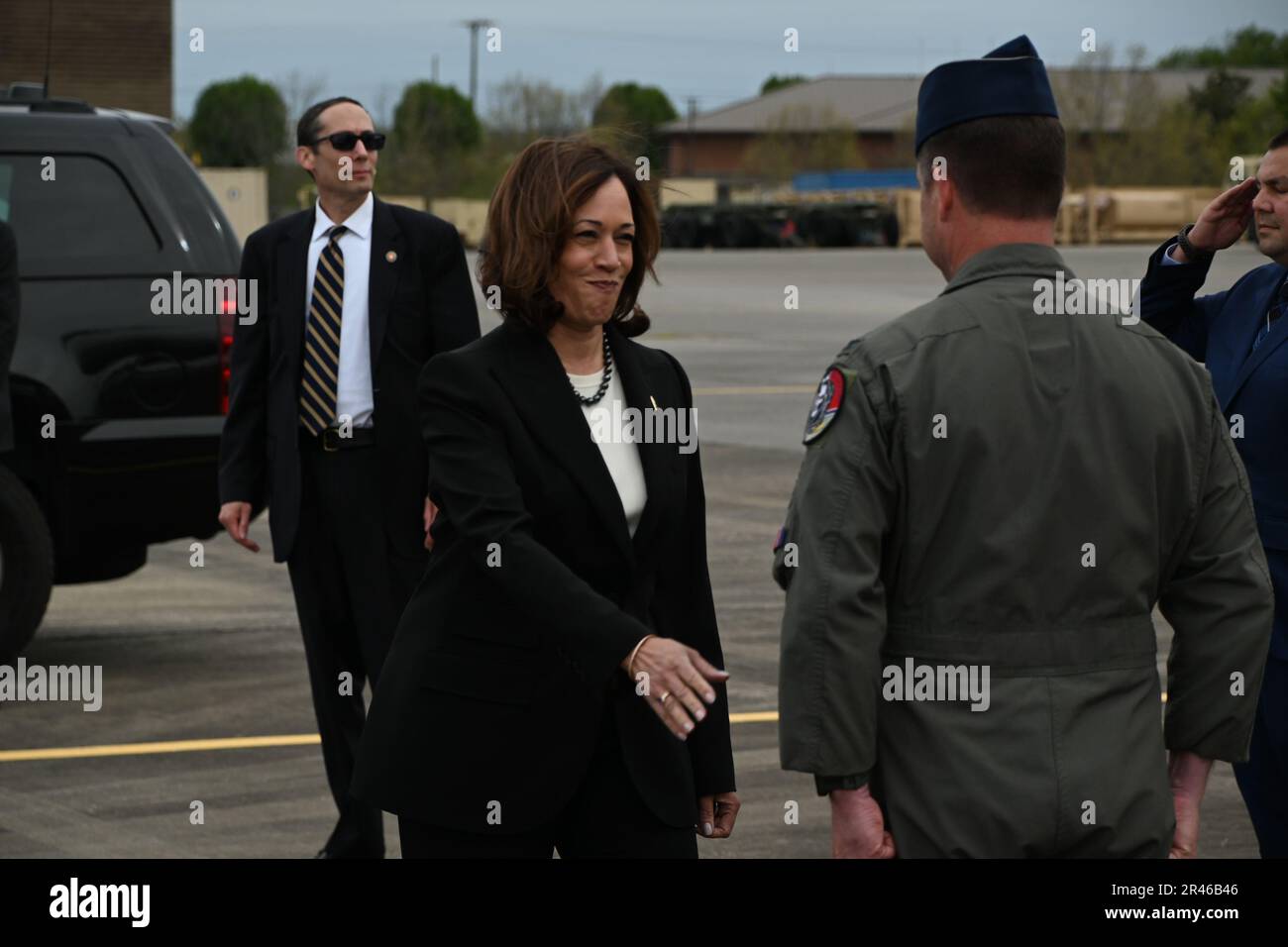 Vice President Kamala Harris greets Col. Ted Geasley, commander of the ...