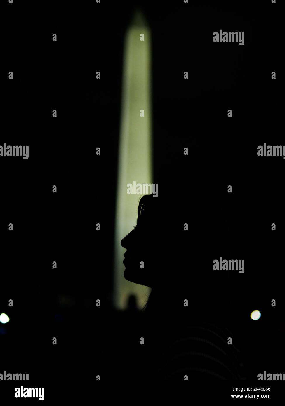 A silhouetted side portrait of a person in a dark room Stock Photo - Alamy