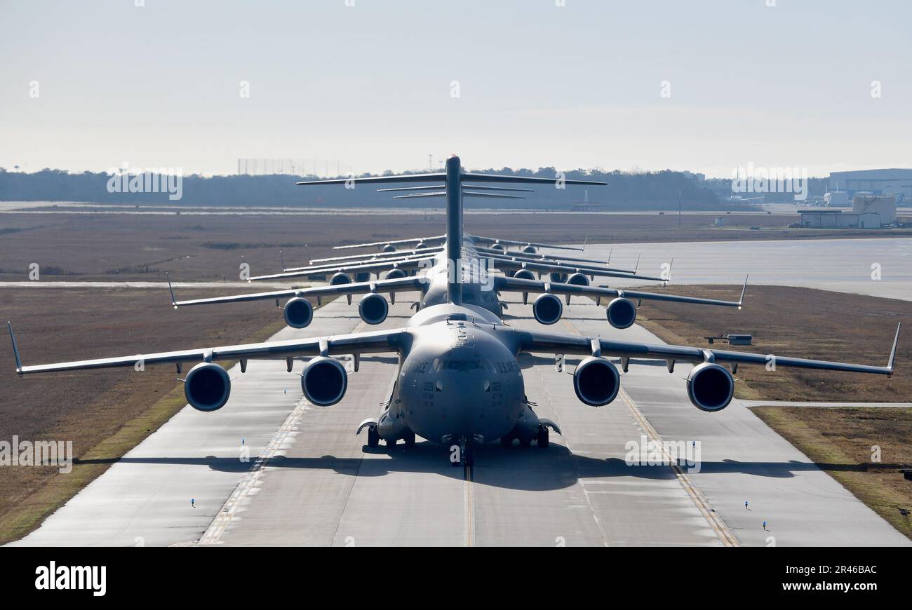 U.S. Air Force C-17 Globemaster III aircraft line up on the taxiway prior to takeoff during a ...